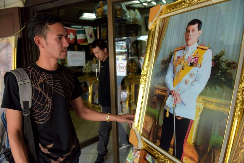 Thais stock up on portraits, T-shirts, flags to welcome new King Rama X ...
