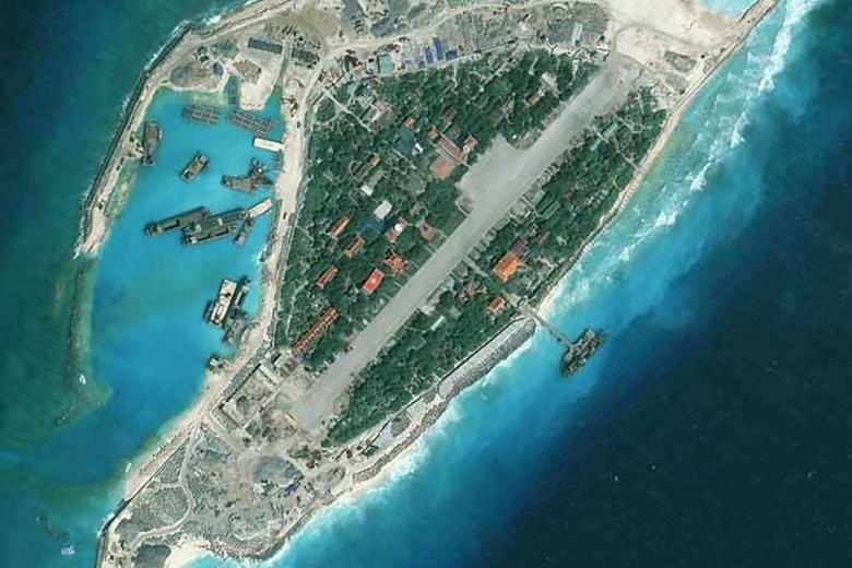 Risking China's ire, Vietnam begins dredging on South China Sea reef ...