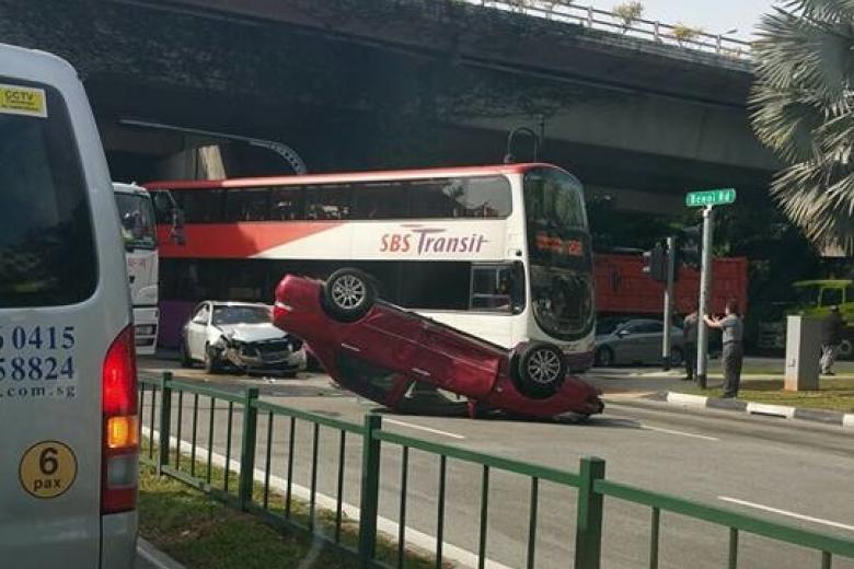 Car overturns after 'running red light' at Benoi Road, 57-year-old man ...