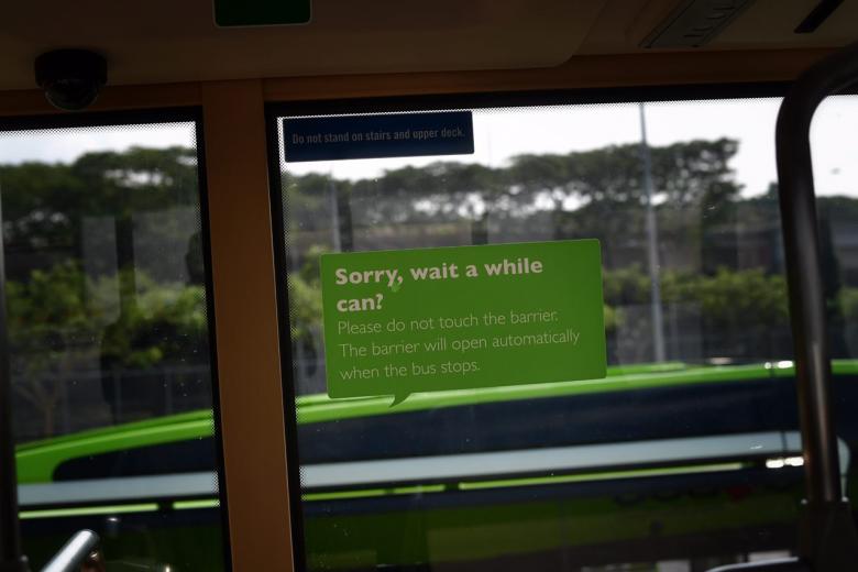 Singlish signs on three-door Tower Transit bus draw praise and concern ...