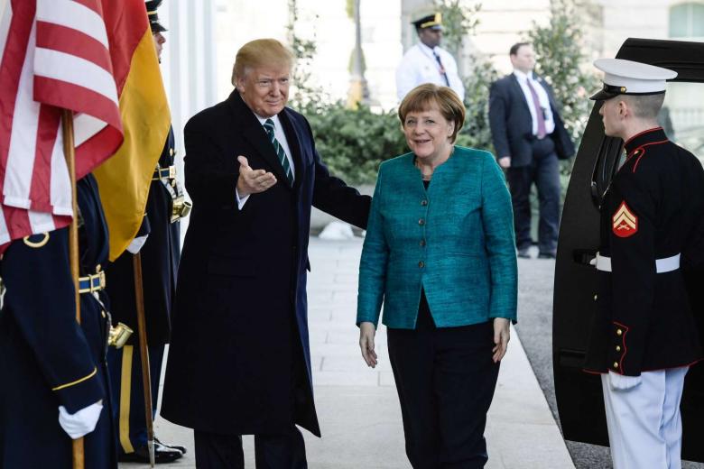 In first Trump-Merkel meeting, awkward body language and a wiretapping ...