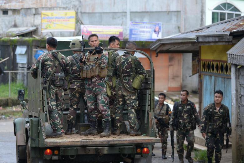 As Philippine military fights to retake city taken over by Islamist ...