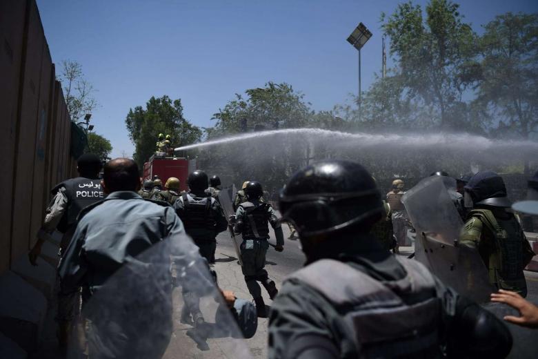 Afghan authorities lock down Kabul after protest clashes | The Straits ...
