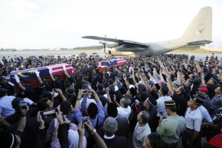 Malaysia sentences 9 Filipino militants to death for 2013 Sabah assault ...