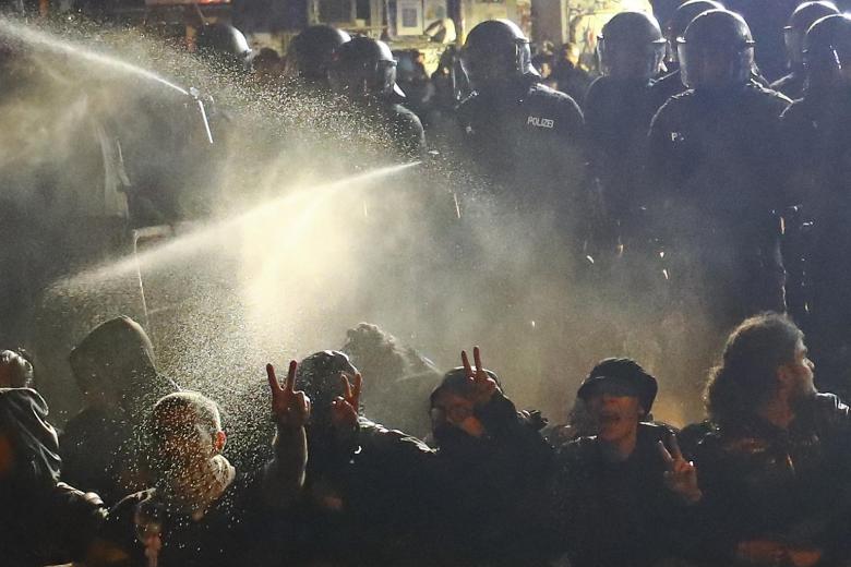 'Embarassment for Germany': Germans angry over violence at Merkel's pre ...