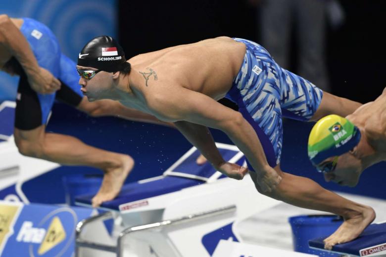 Swimming: A proud Benjamin wins 50m fly at World C'ships with Schooling ...