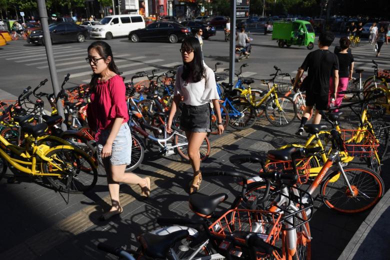 Beijing applies brakes on shared bicycles to stop problems including ...