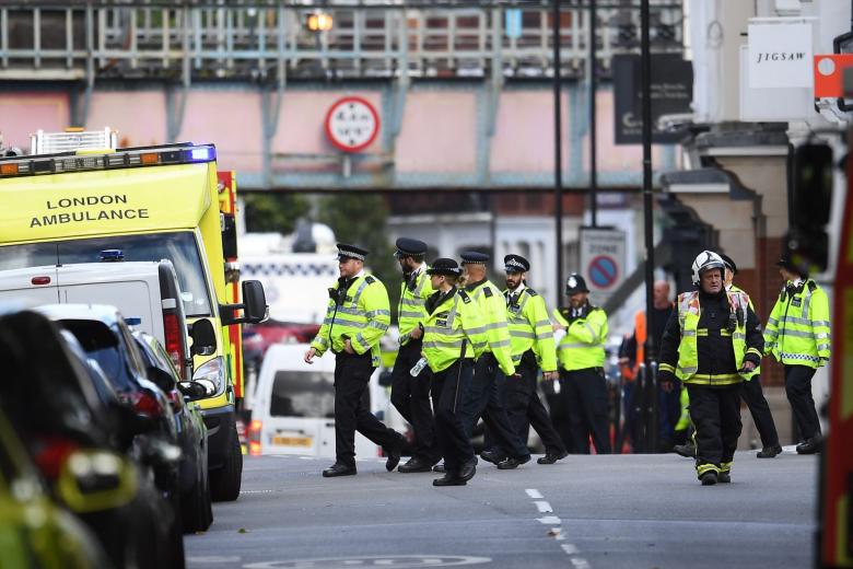 Second man arrested over London train attack, threat level lowered ...
