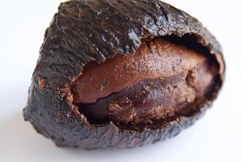 Malaysia's dying art of curing buah keluak | The Straits Times