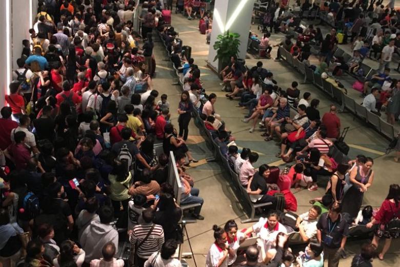 Long queues at Marina Bay Cruise Centre due to boarding delays for ...