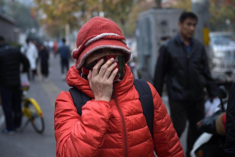 Beijing issues first major winter smog alert as plunging temperatures ...