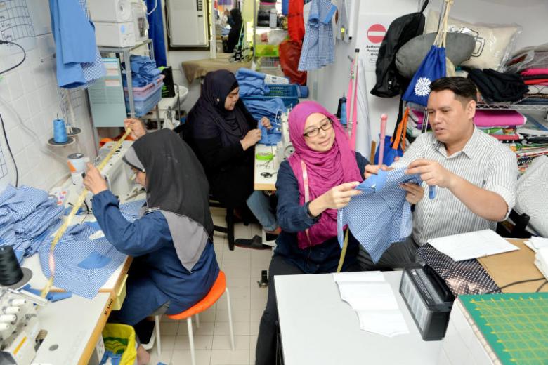 Stitching up a good cause with single mums sewing baju kurung for Hari ...