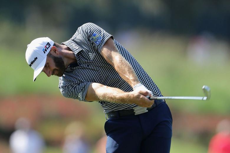 Golf: Johnson finds putting touch to share first-round lead at Players ...