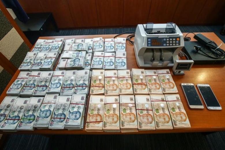 $590,000 seized from two men who allegedly extorted money in ...
