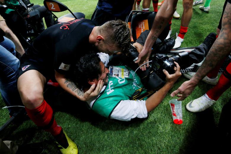 World Cup: Photographer proves a good shot after getting squashed by ...