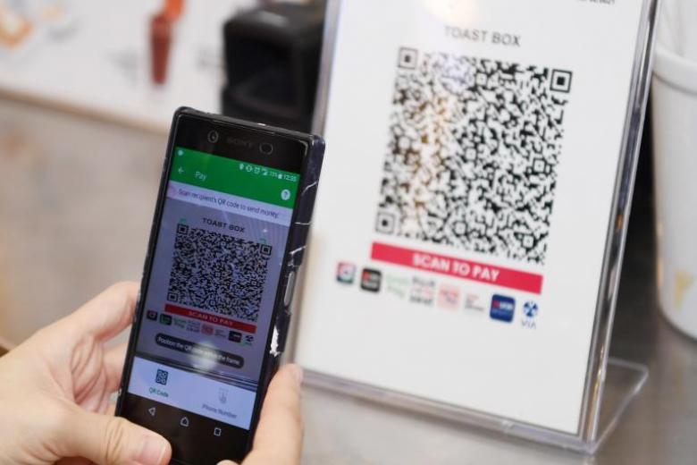 World's first unified payment QR code credit positive for Singapore ...