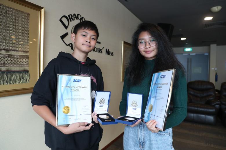 Siblings receive SCDF award for saving drowning boy on Christmas Day ...