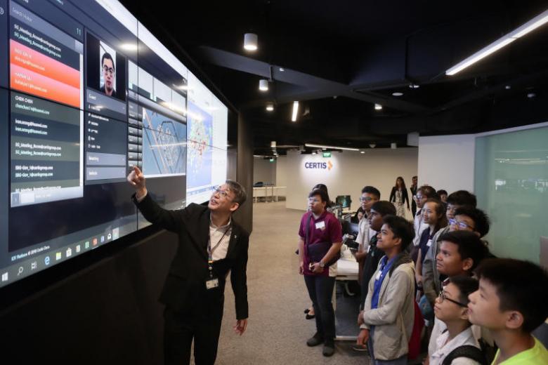 Students view tech behind security in exclusive tour of Certis command ...