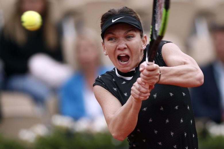 Tennis: Reigning champion Halep stumbles into French Open round three ...