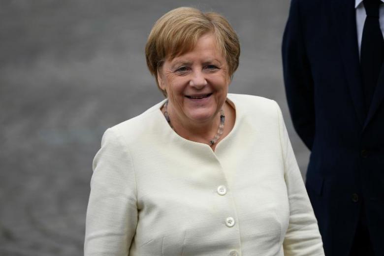 German Chancellor Angela Merkel turns Paris visit into show of fitness ...