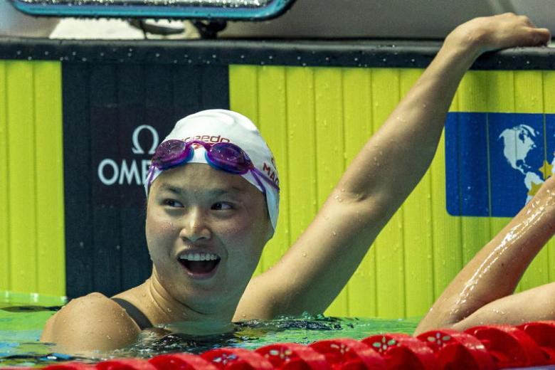 Swimming: Margaret MacNeil upsets holder Sarah Sjostrom to win 100m fly ...