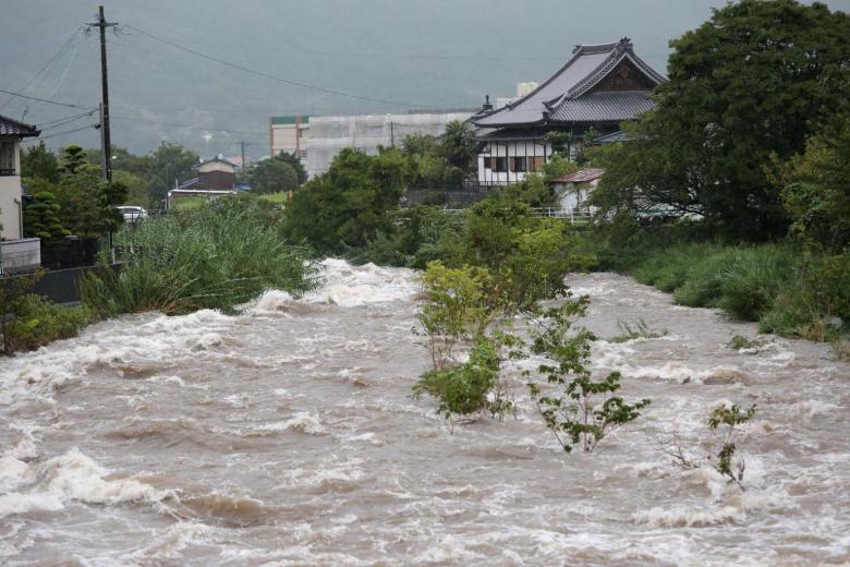 At least 2 killed, 850,000 people evacuated as record rains cause ...
