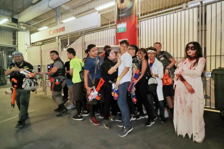 Hundreds of 'zombies' throng National Stadium for live-action survival ...