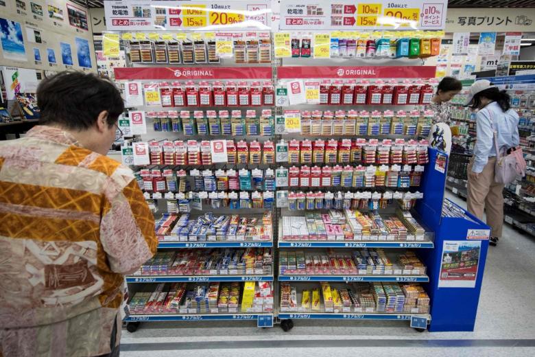 Japan retail sales post worst fall in 4 years as sales tax hike hits ...