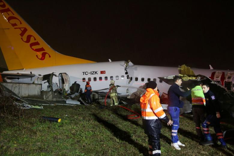 Turkish jet splits open on landing, killing three and injuring 180 ...