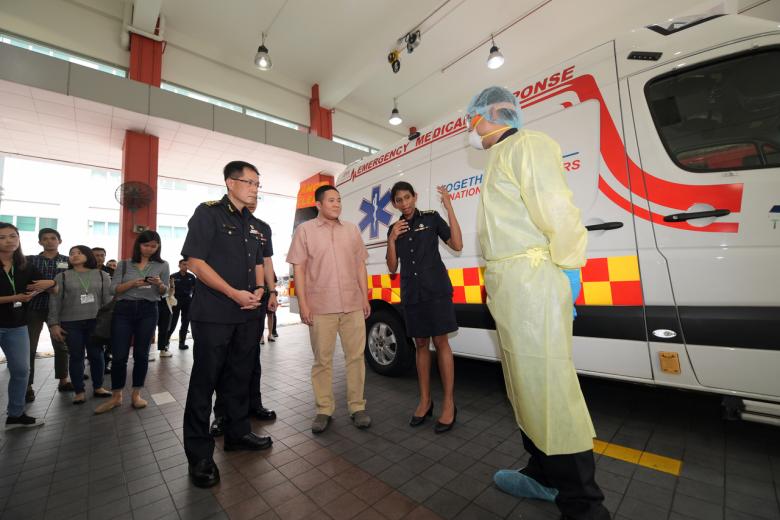 Coronavirus: SCDF paramedics don protective gear in attending all cases ...