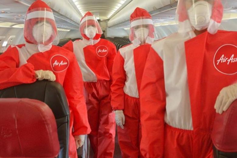 AirAsia unveils red PPE suits for cabin crew | The Straits Times