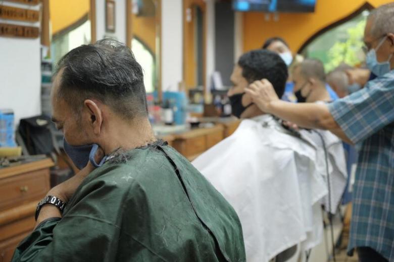 Coronavirus: Customers flock to barbers and bakers after they are ...