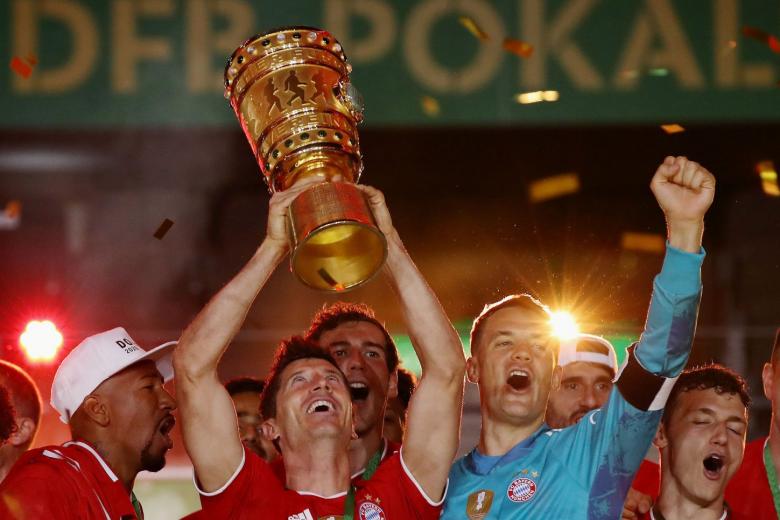 Football: Lewandowski passes 50-goal mark as Bayern win 20th German Cup ...