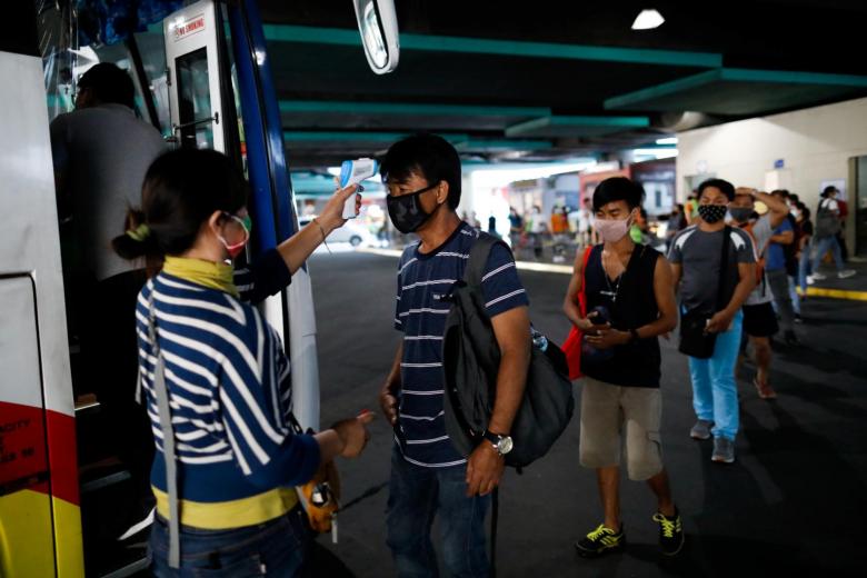 Manila may return to lockdown as coronavirus cases surge | The Straits ...