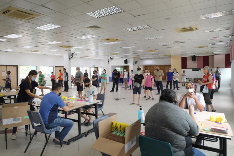 Long queues for TraceTogether tokens at Marsiling Community Club, first ...