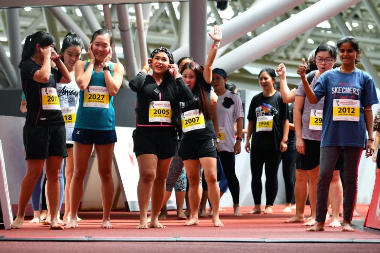 200 take part in barefoot race at Our Tampines Hub while observing safe ...