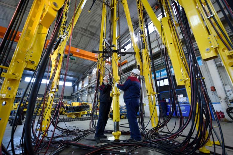 China factory activity expands at slower pace in December | The Straits ...