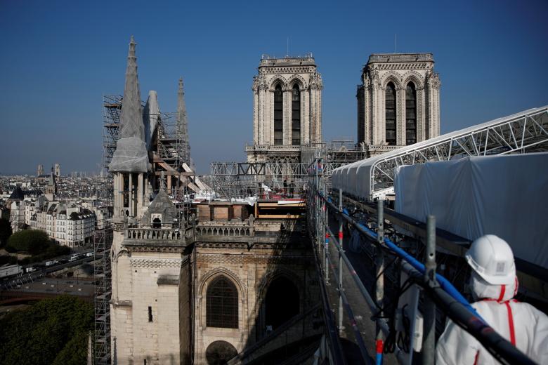 Macron scales Notre-Dame's rooftop two years after cathedral fire | The ...