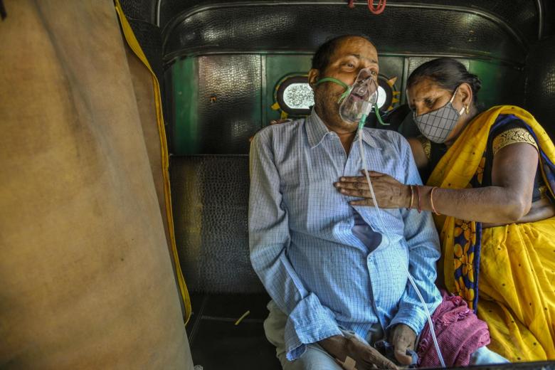 Lifesaving oxygen aid arrives in India as Covid-19 death toll hits new ...