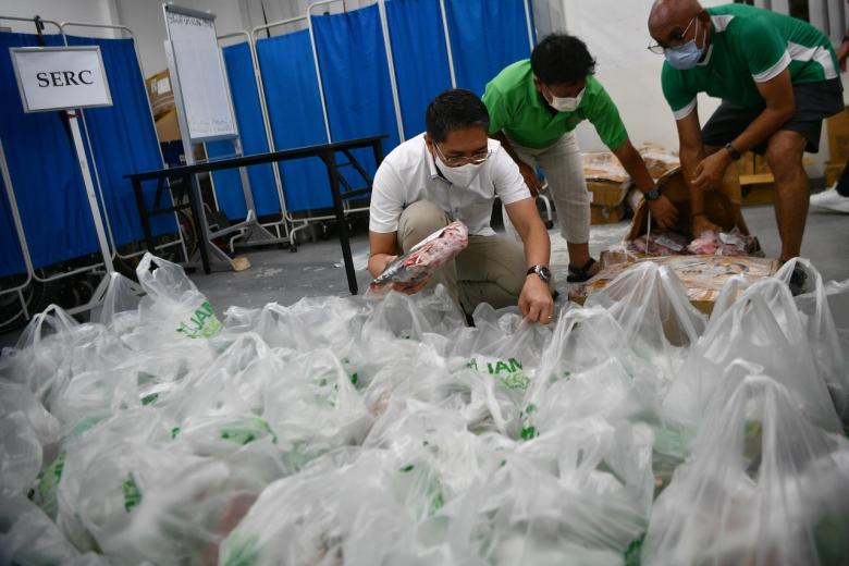 Food packs with meat, rice distributed in S'pore ahead of Hari Raya ...