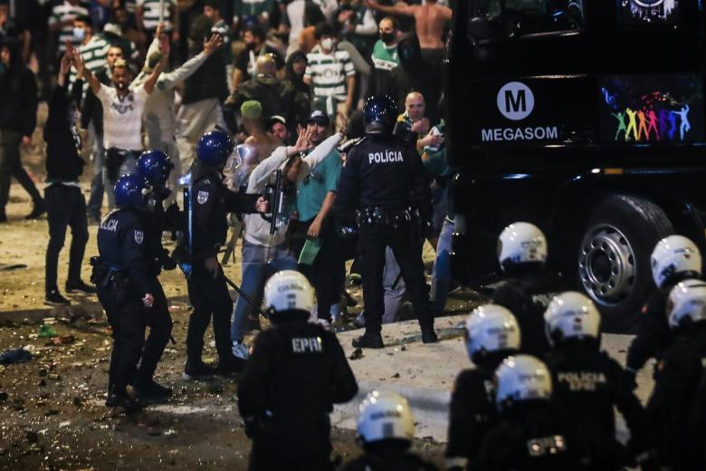 Football: Sporting title celebrations marred as fans clash with riot ...