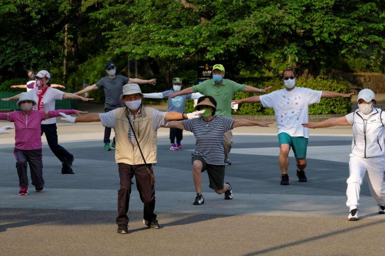 One, two, three! Millions of Japanese perform 'taiso' stretching ...