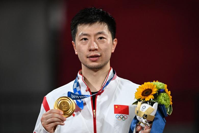 Olympics: China's Ma Long beats compatriot to retain table tennis crown ...