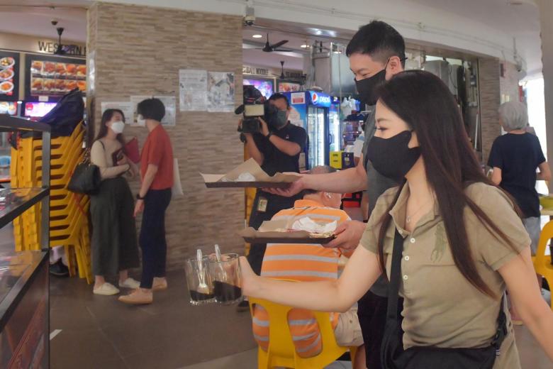 Many diners clearing trays at coffee shops, foodcourts before new rule ...