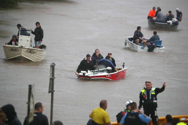 Rooftop rescues as tens of thousands evacuated from Australia floods ...