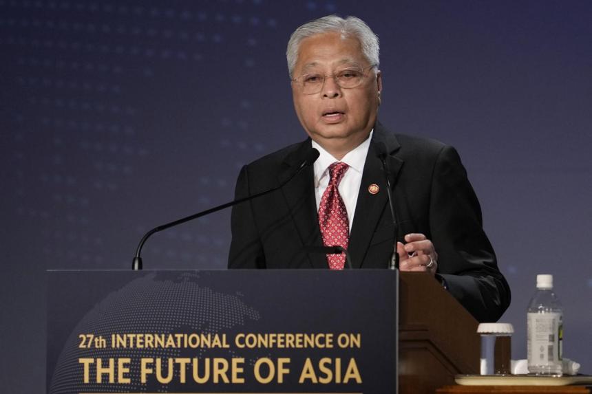 Malaysia PM Ismail downplays early election talk, citing inflation ...