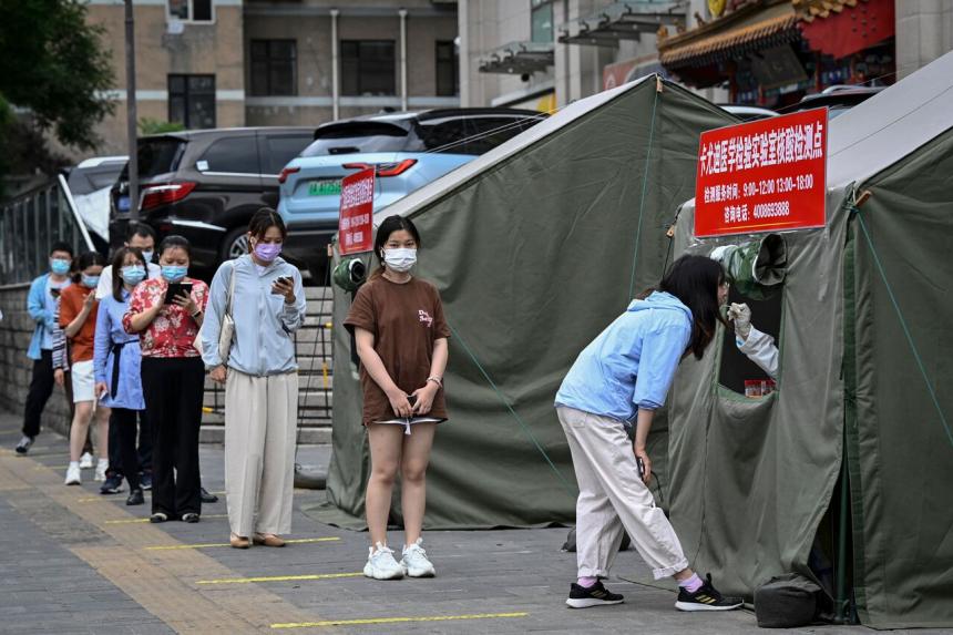 Beijing in ‘race against time’ to contain Covid-19 surge | The Straits ...