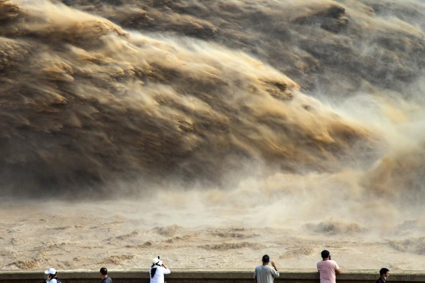 Wall of water and sand | The Straits Times