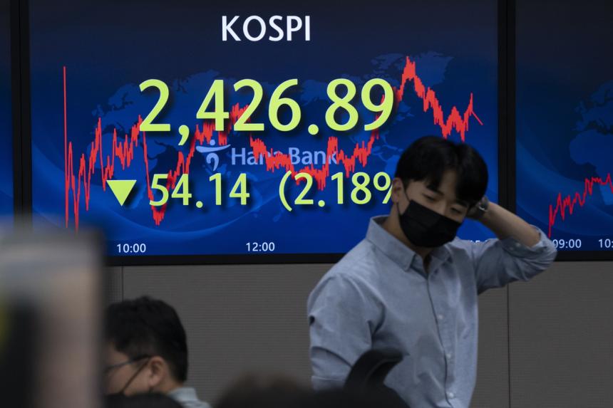 Asian markets fall after Fed says it will continue to hike rates to ...