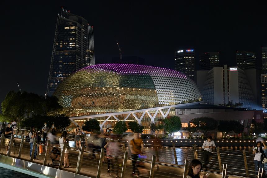 Iconic landmarks in S'pore lit in purple and yellow to mark World ...